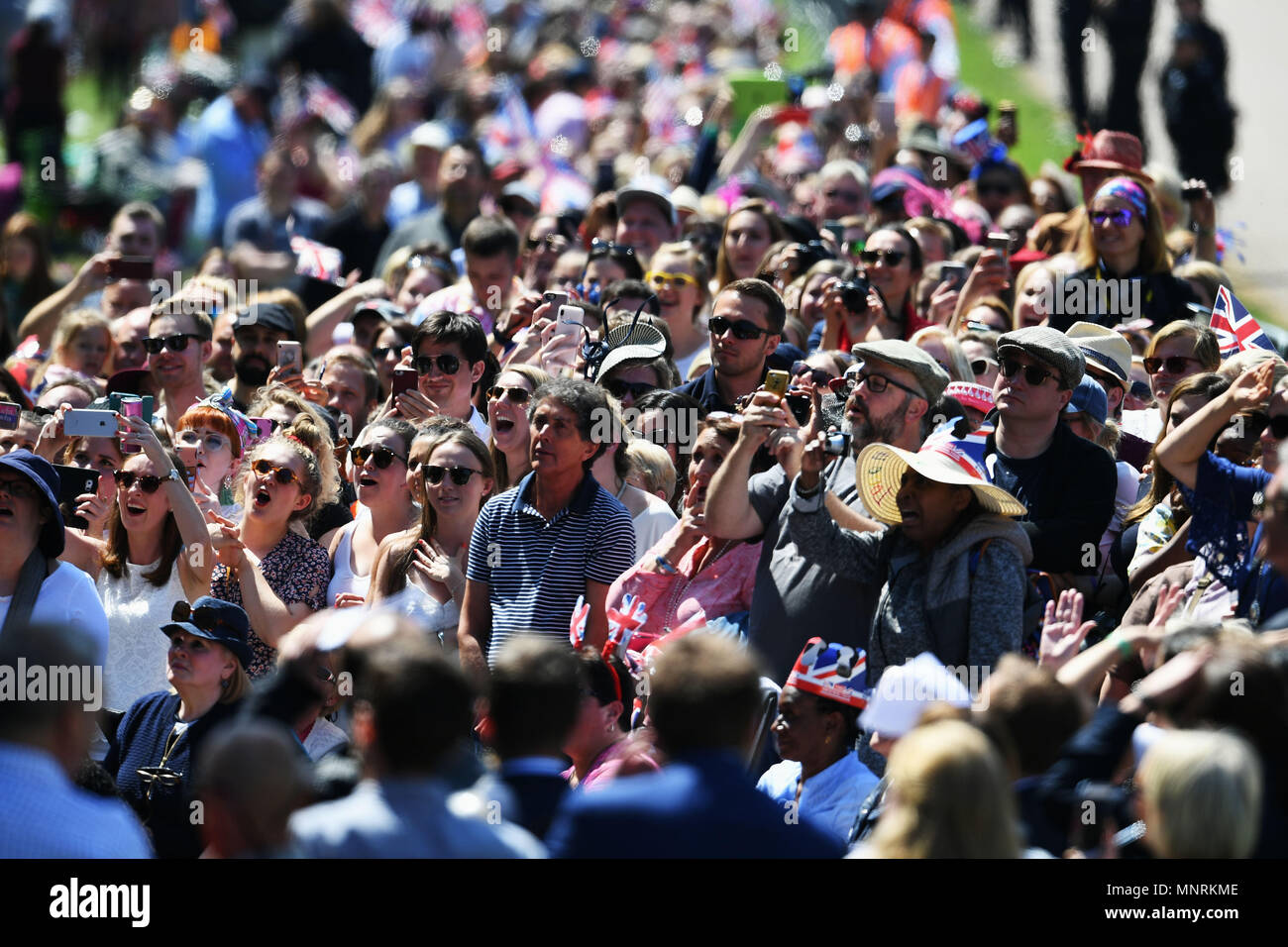 The crowd watch as Meghan Markle accompanied by her mother, Ms Doria ...