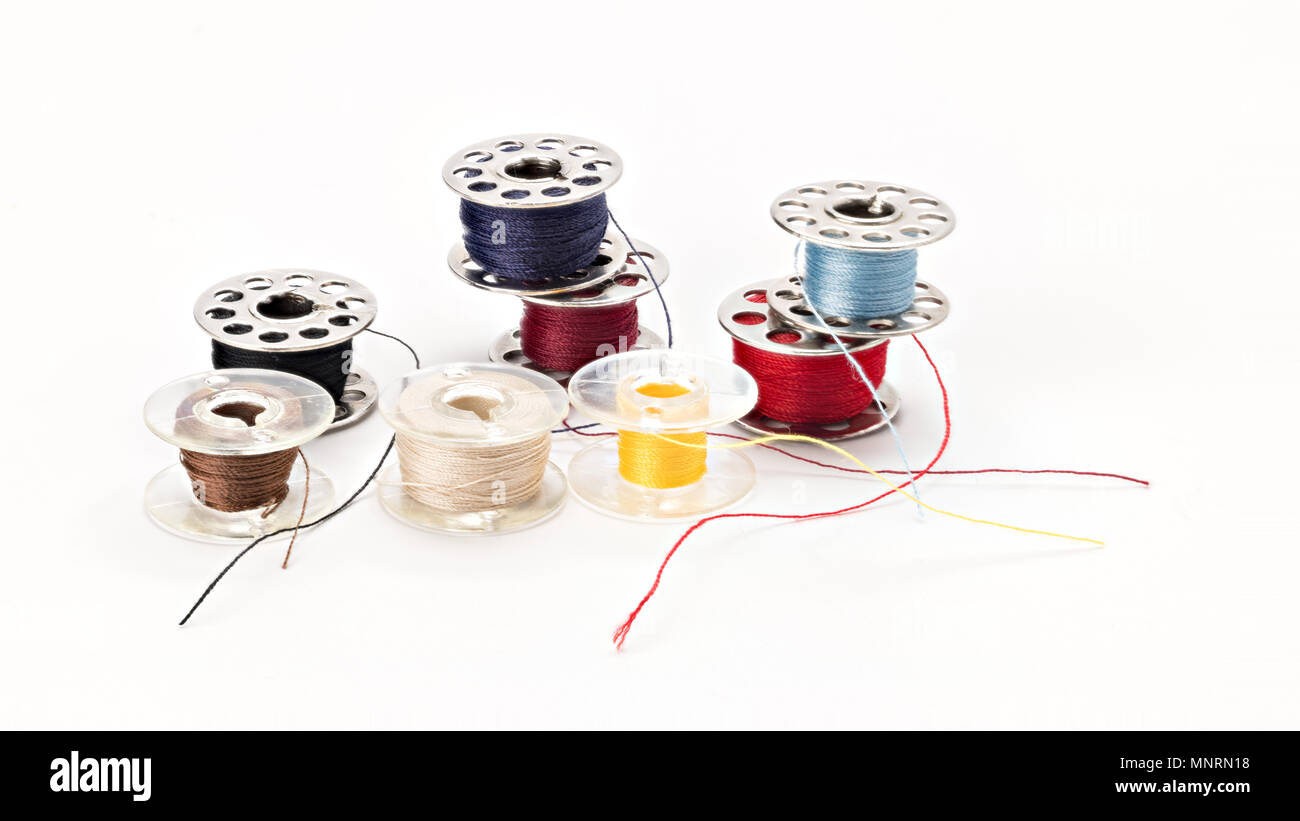 Colors of thread on metal bobbins used for sewing garments Stock Photo ...
