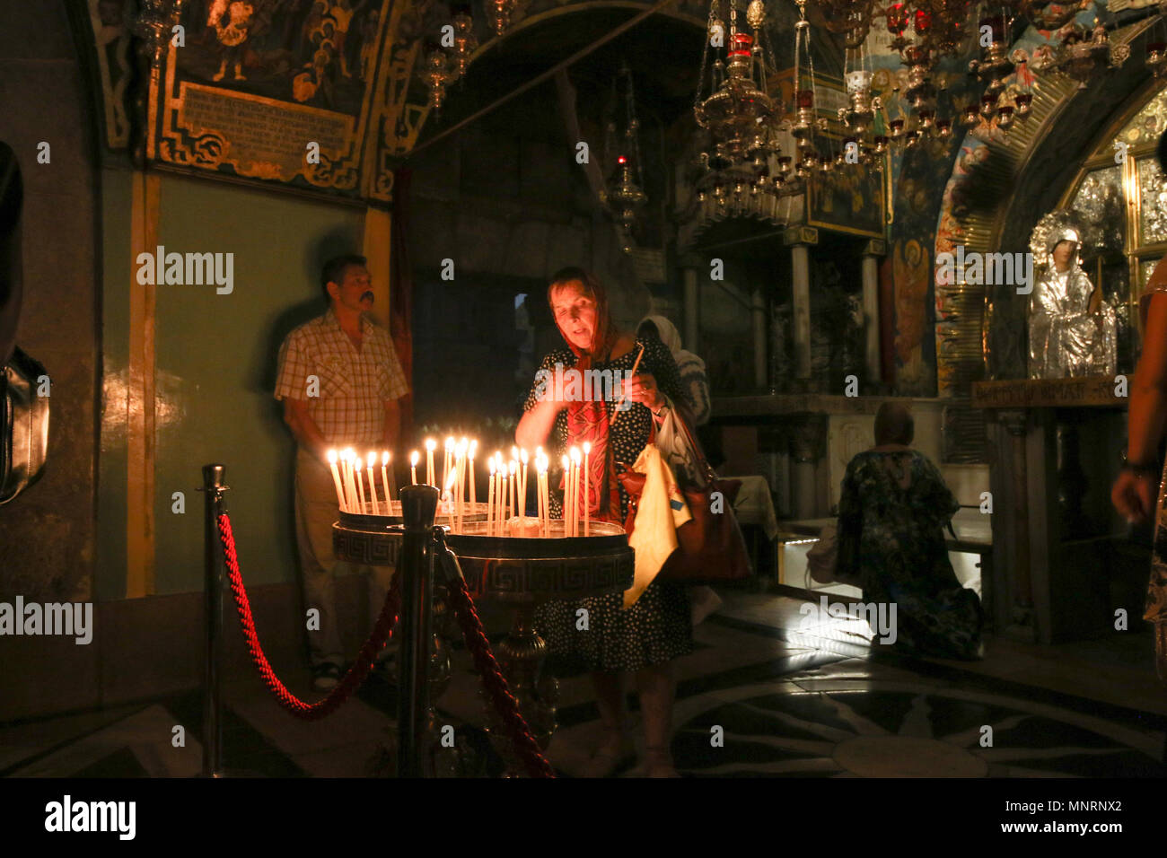 Jerusalem, Israel - May 16, 2018: A deeply religious woman lights ...