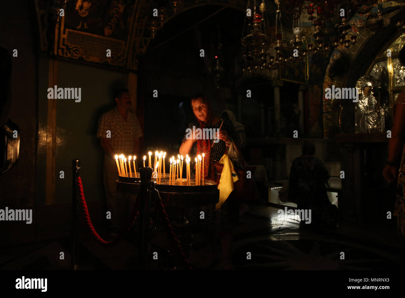Jerusalem, Israel - May 16, 2018: A deeply religious woman lights ...