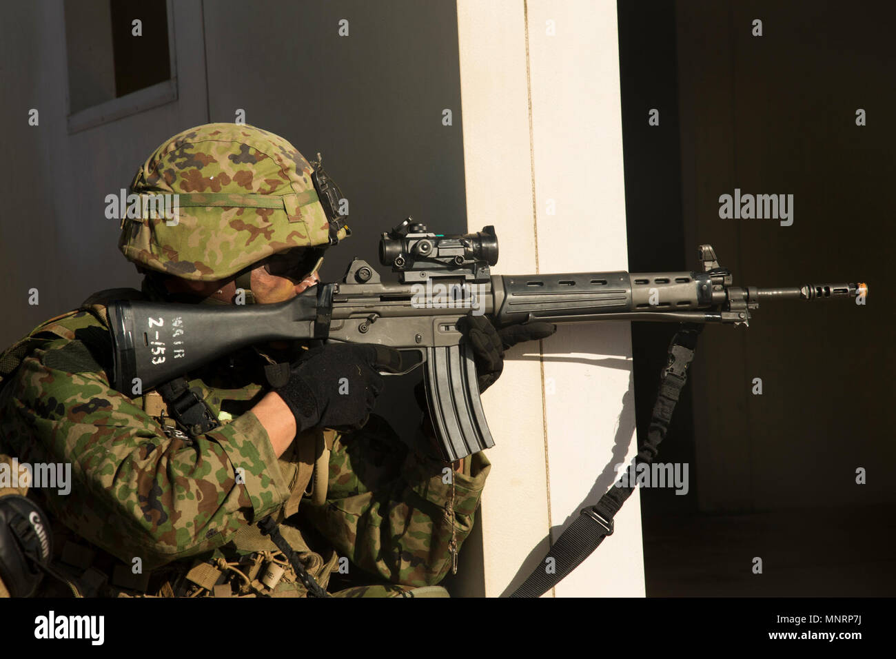 A Japanese Solder with Western Army Infantry, sights in during a ...