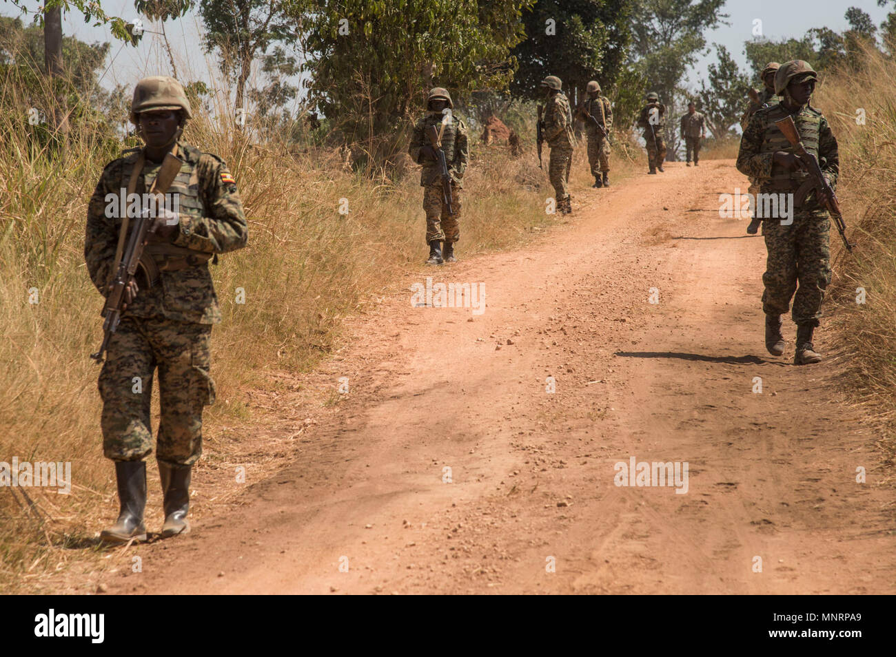 Uganda Peoples' Defence Force soldiers practice ground maneuvers during ...