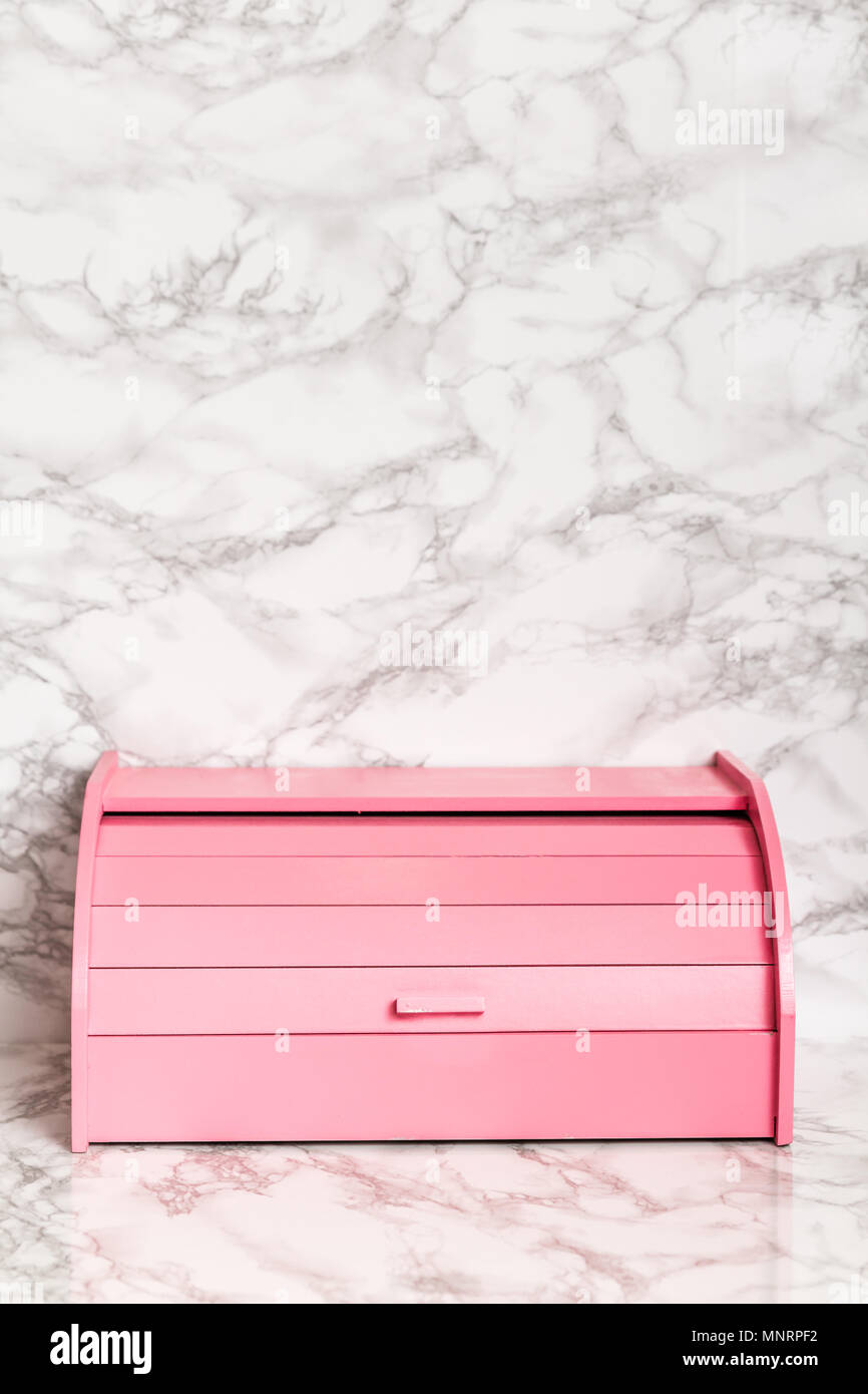 Pink wooden bread box on white marble background Stock Photo - Alamy