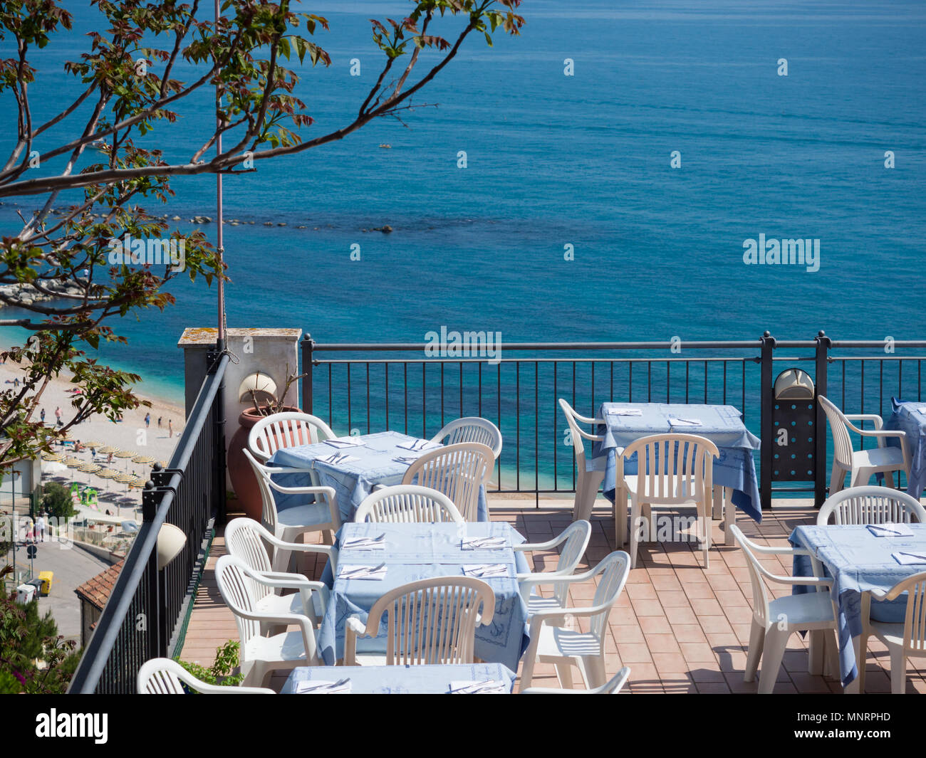 Restaurant tables overlooking mediterranean sea hi-res stock ...
