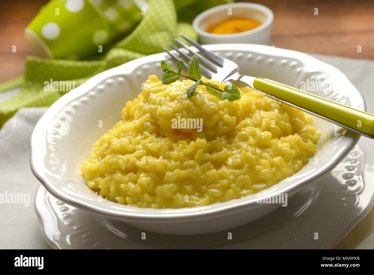 italian risotto with mint leaf on porcelain plate - closeup Stock Photo ...