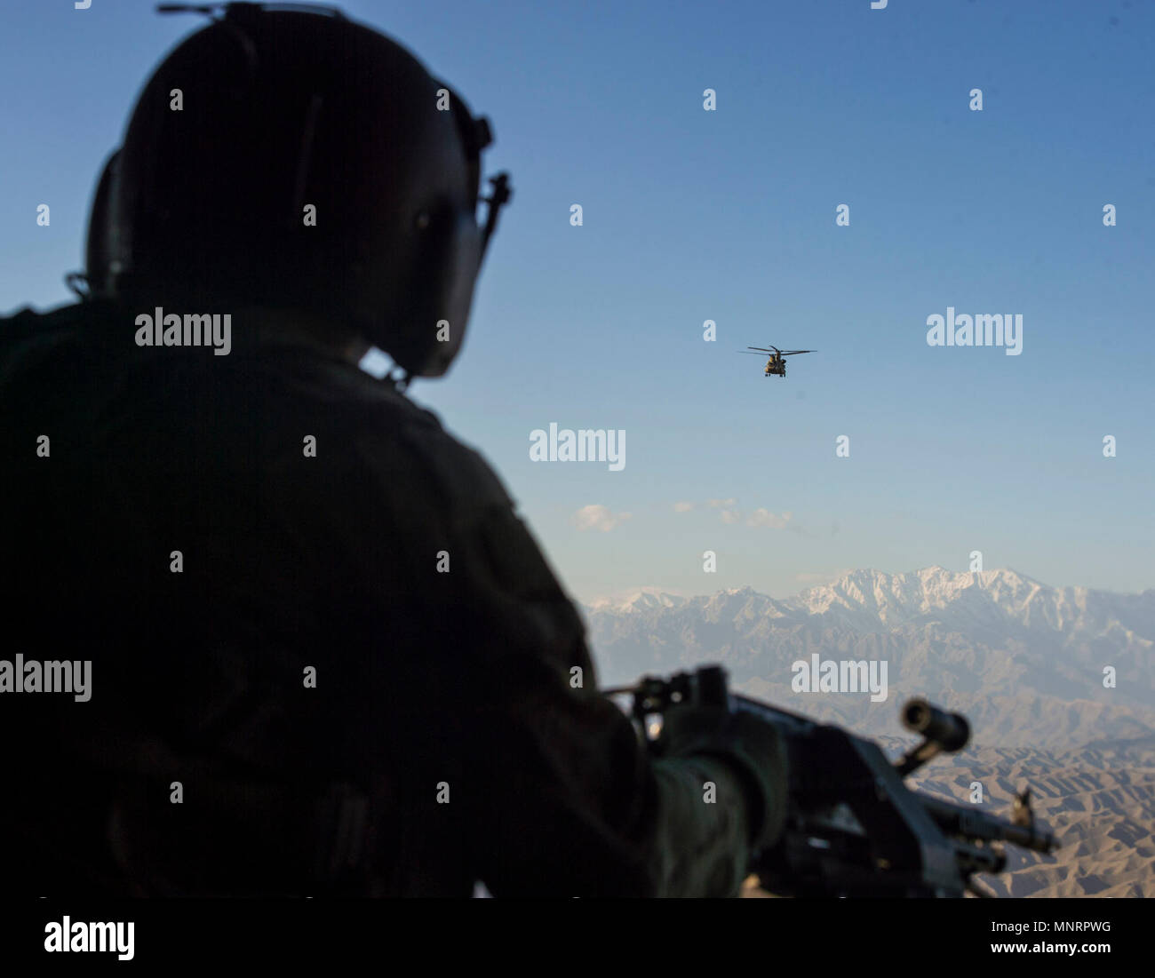 A U.S. Army CH-47 Chinook Helicopter door gunner, assigned to U.S. Army ...