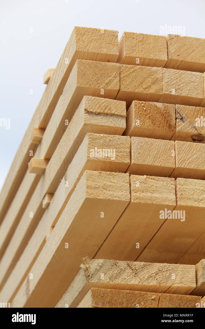 Stack of new wooden studs at the lumber yard, isolated on white Stock ...