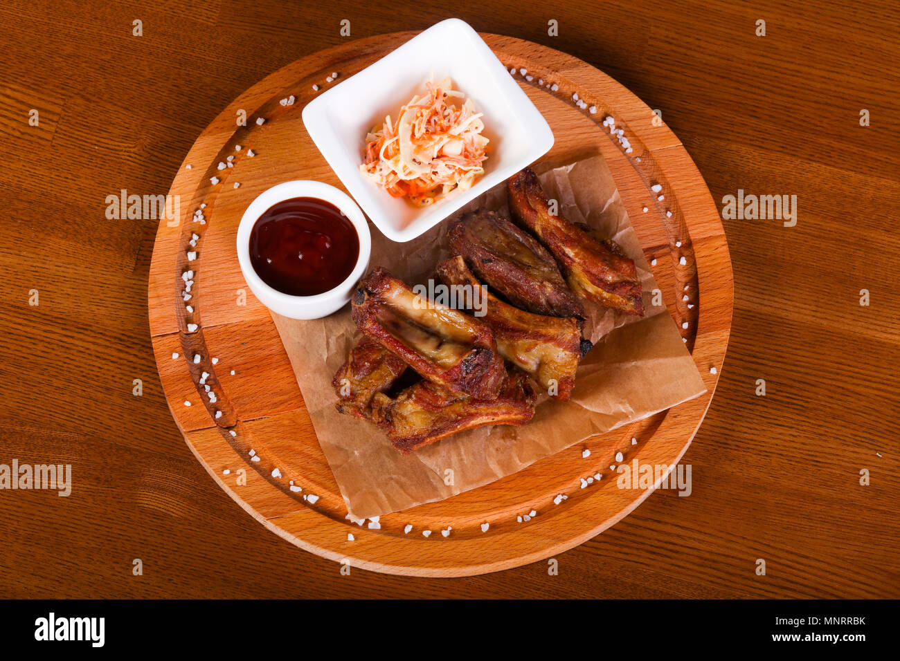 Pork ribs with sauce and cabbage Stock Photo - Alamy