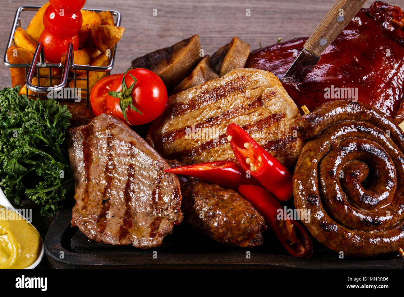Grilled meat mix plate - beef, pork and chicken Stock Photo - Alamy