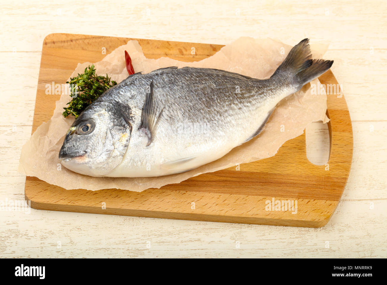 raw dorada fish - ready for cooking Stock Photo - Alamy