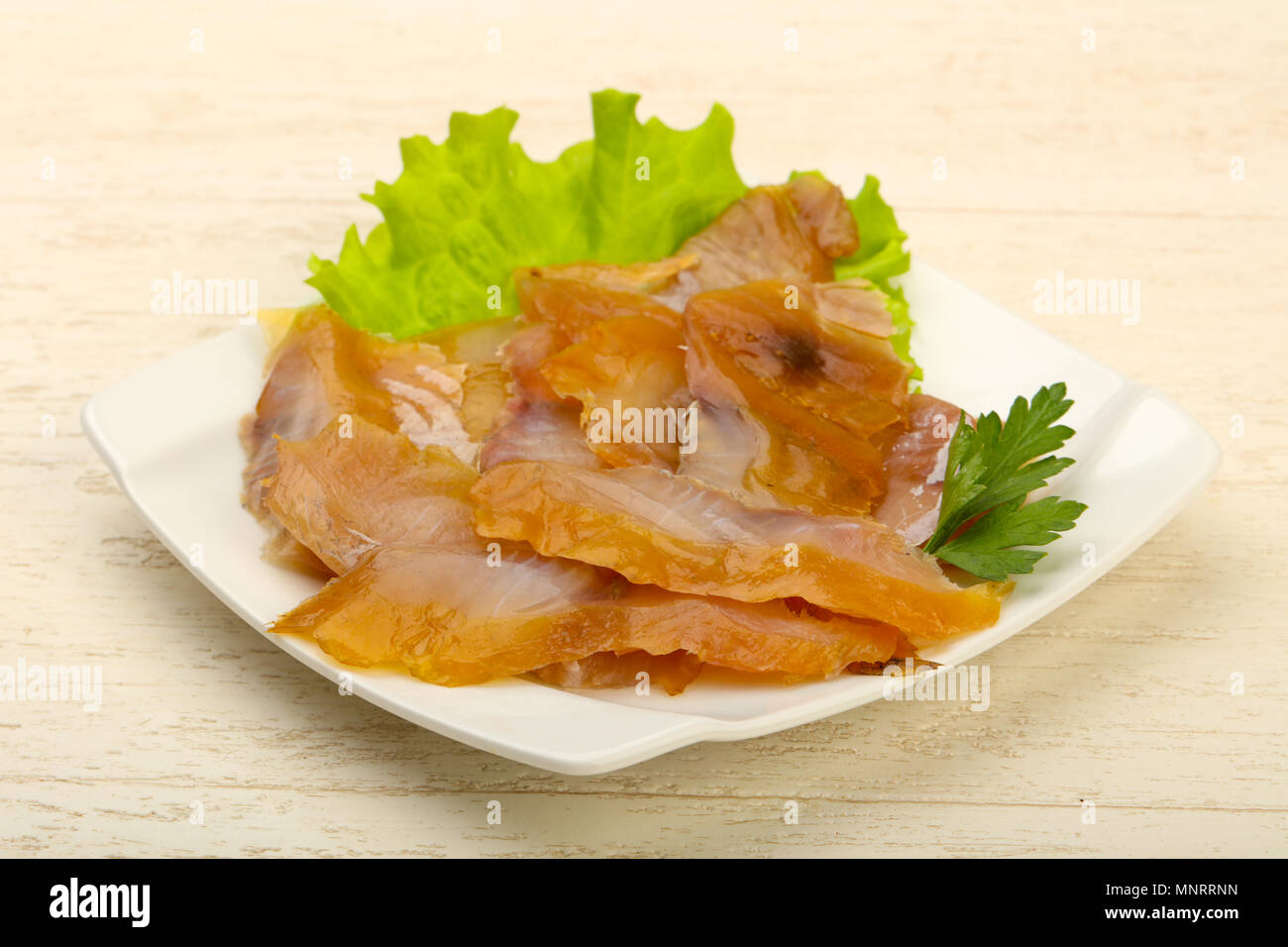 Smoked catfish fillet carpaccio Stock Photo - Alamy
