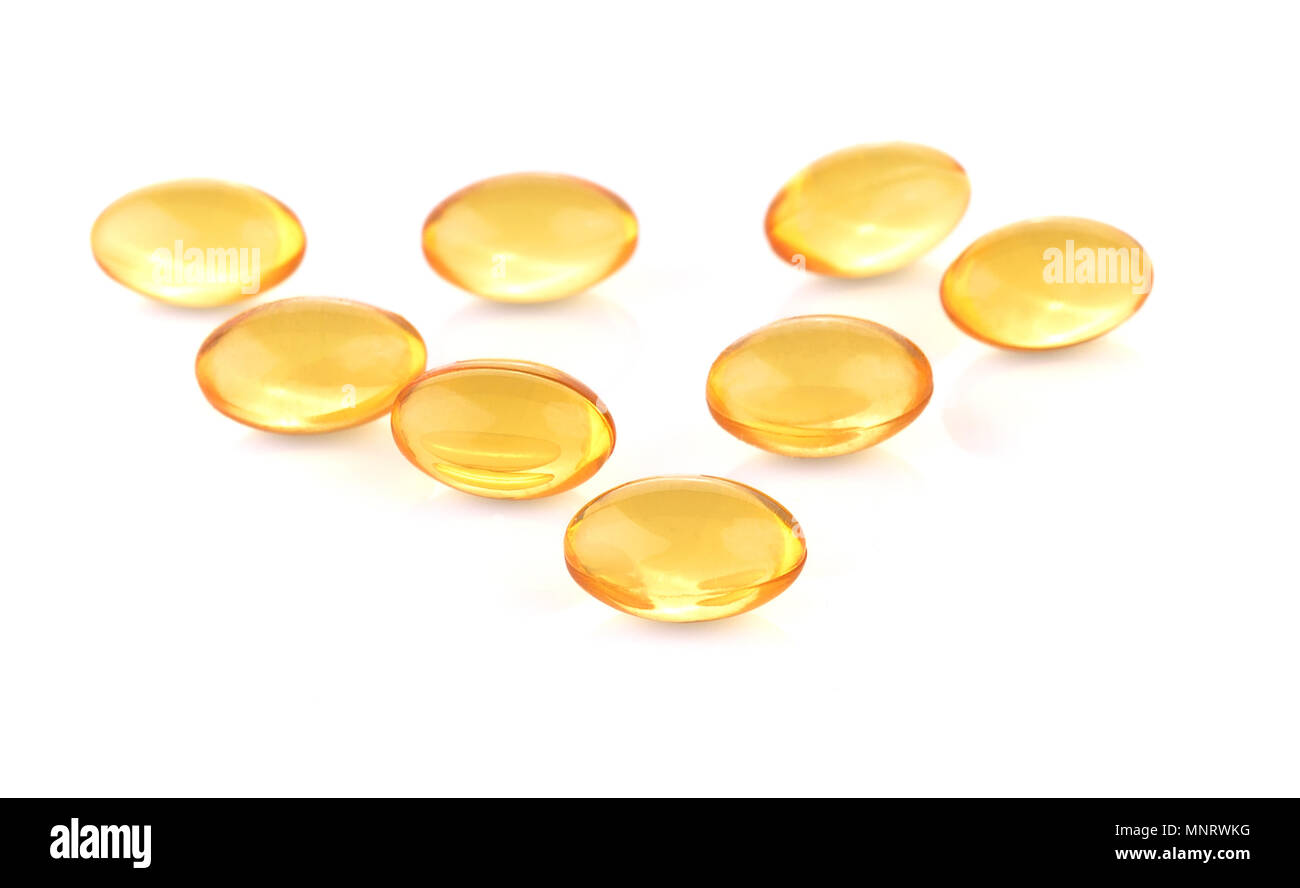 Fish oil pill on white background Stock Photo - Alamy