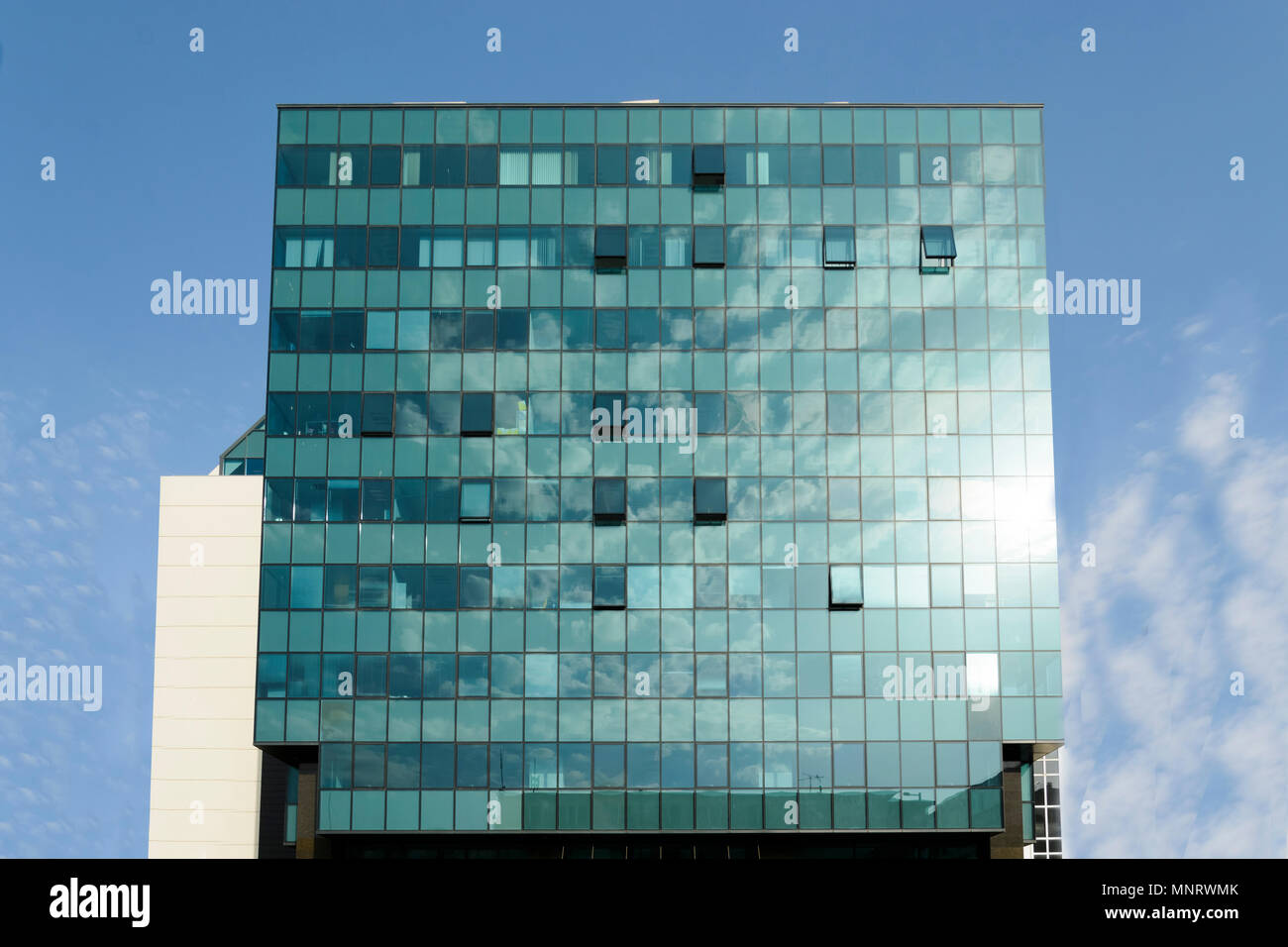 Front view of a building , glass building with clouds reflexion Stock ...
