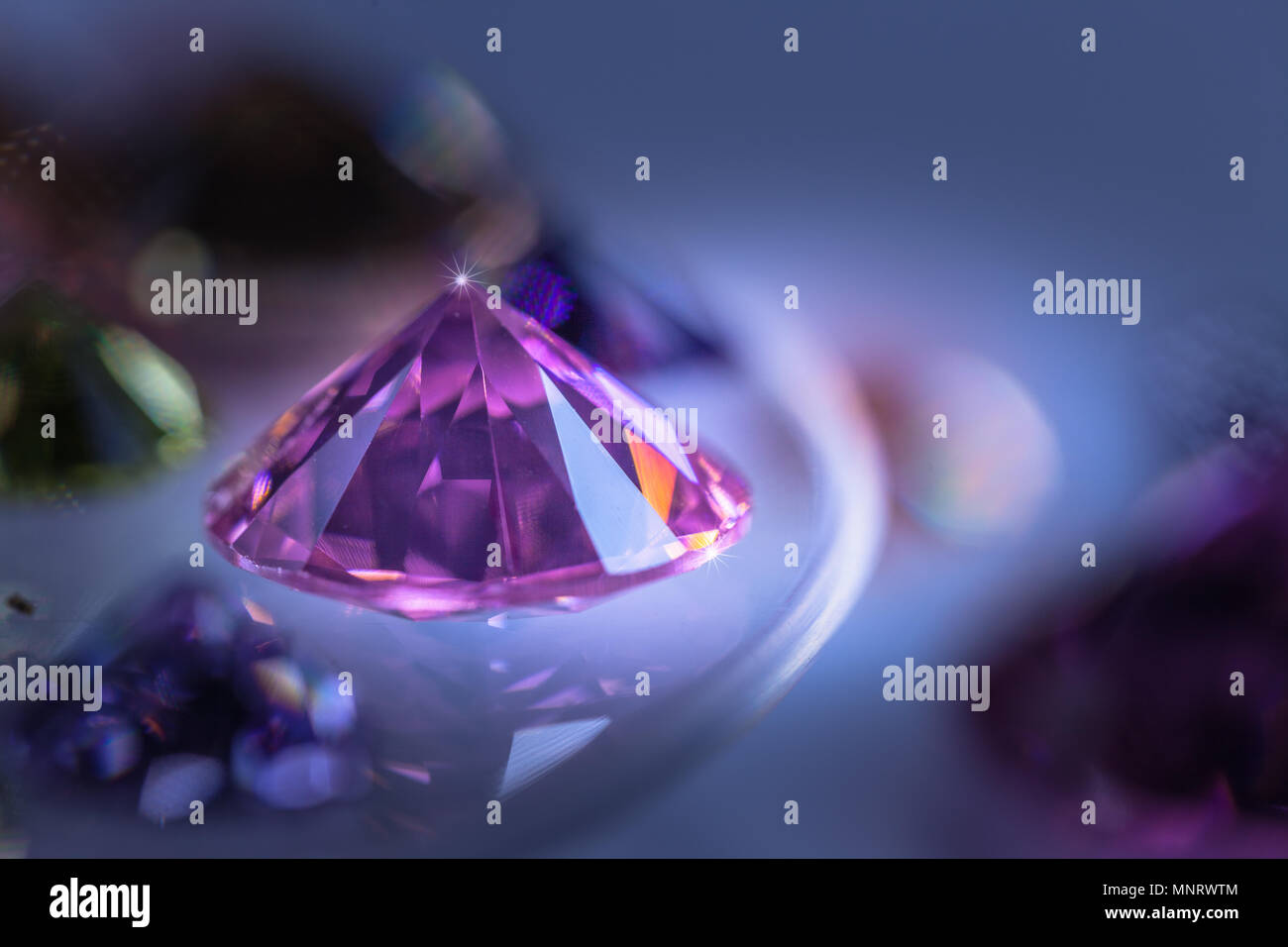 purple gems are displayed on rotating platforms Stock Photo - Alamy
