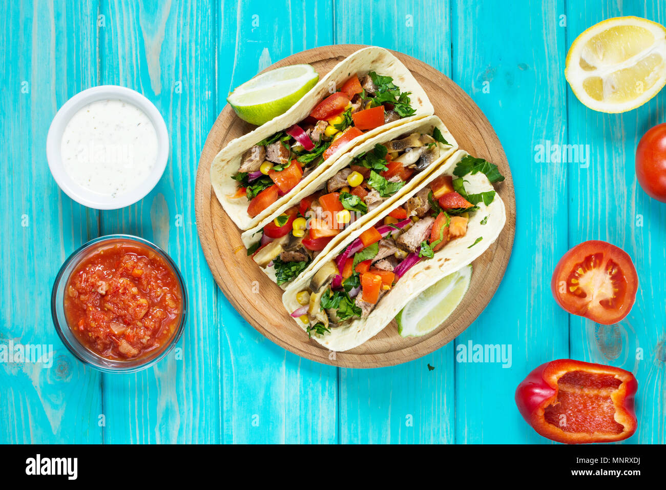 Mexican pork tacos with vegetables. Tacos al pastor on wooden blue ...