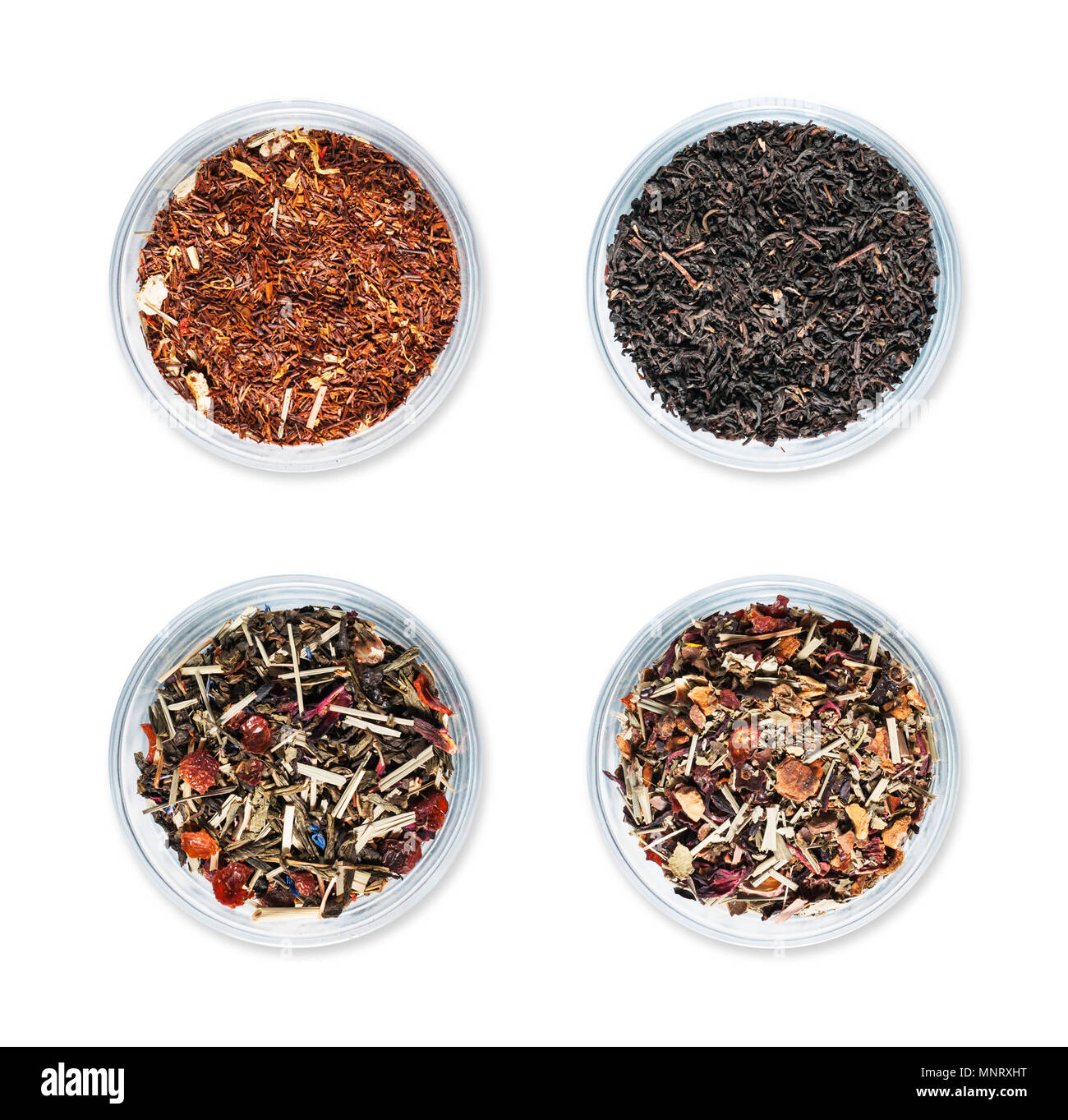 four bowls with different types of tea on white background isolated ...
