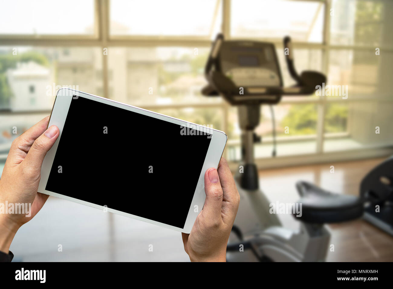 Young man Hand holding smartphone in gym to fitness phone fitness ...