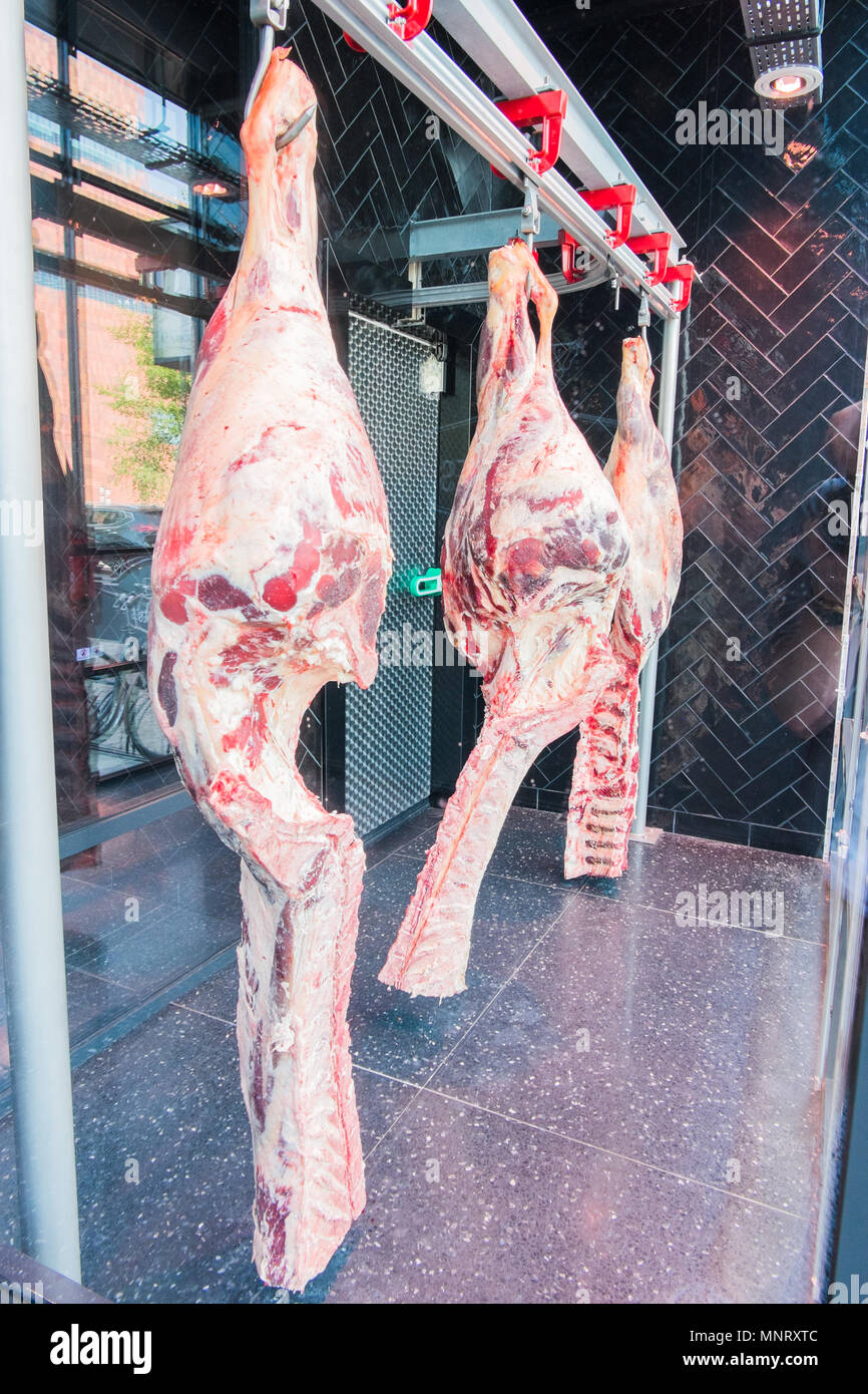 raw meat hanging on Stock Photo - Alamy