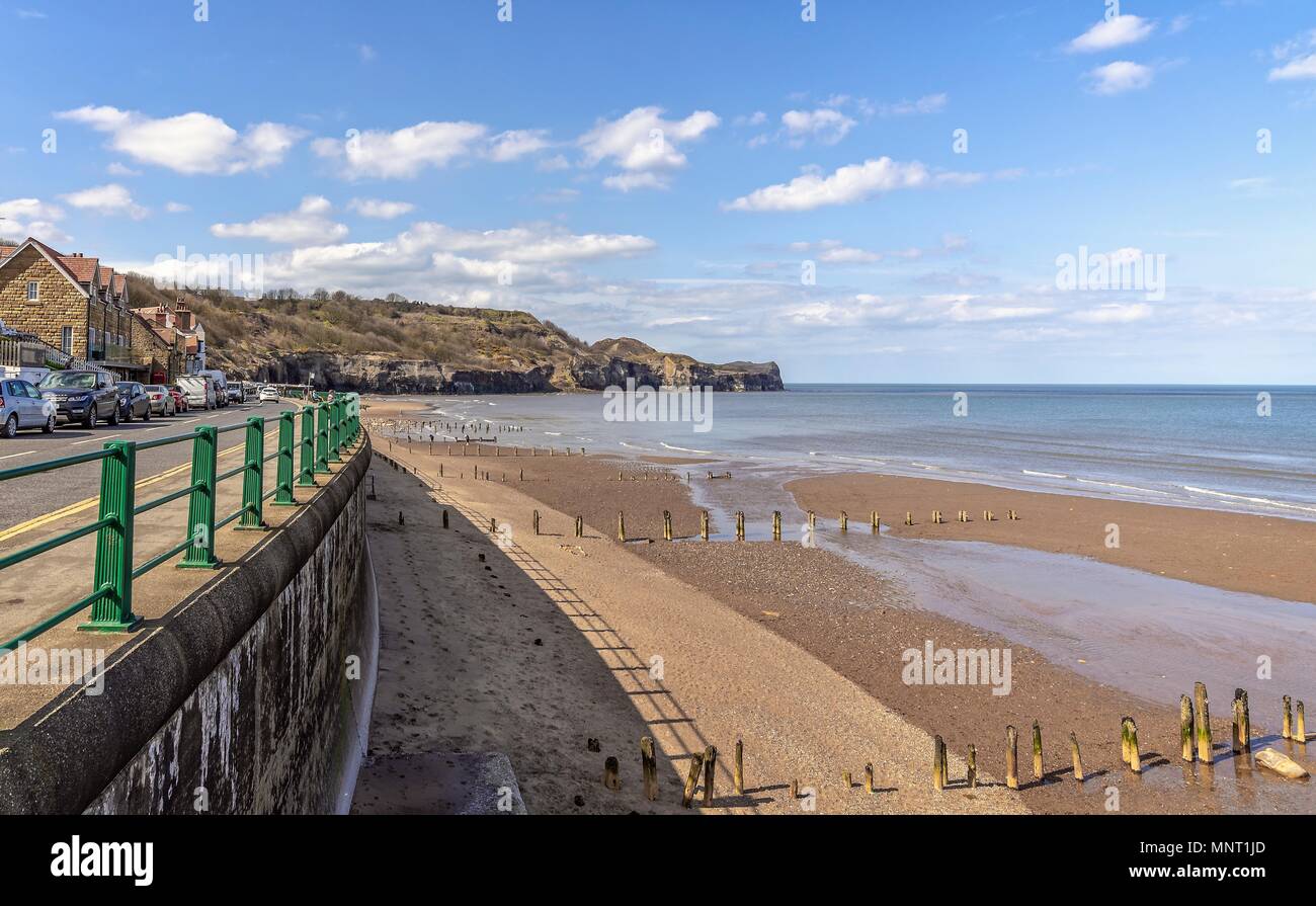 The quay at sandsend ith railings. Below is a stretch of the shingle ...
