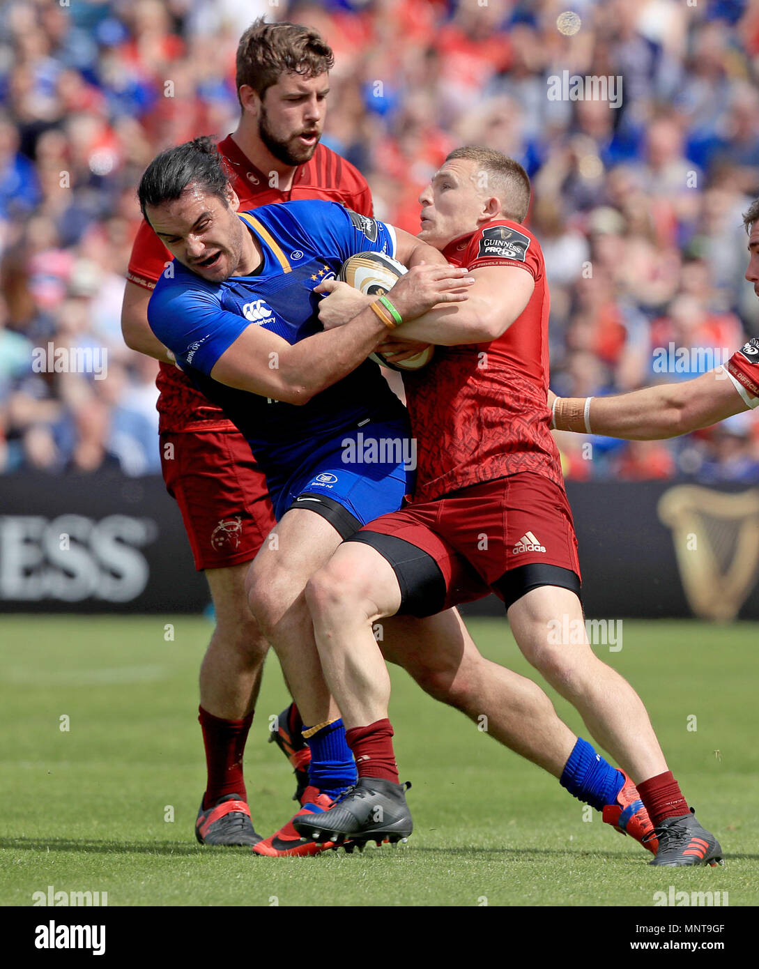 Leinster's James Lowe of Leinster with Munster's Andrew Conway and Rhys ...