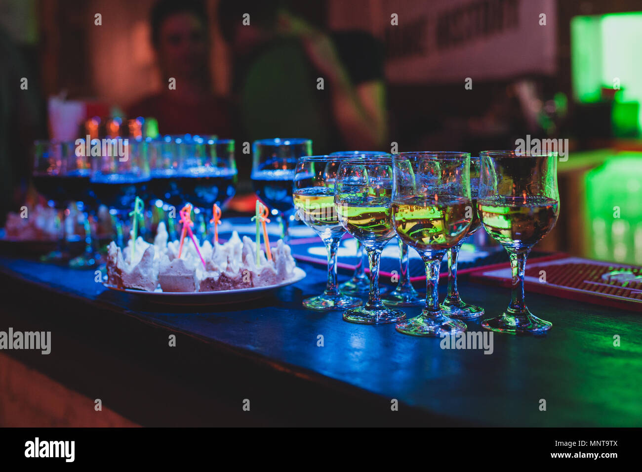 Wine and appetizers on party in the night club Stock Photo - Alamy