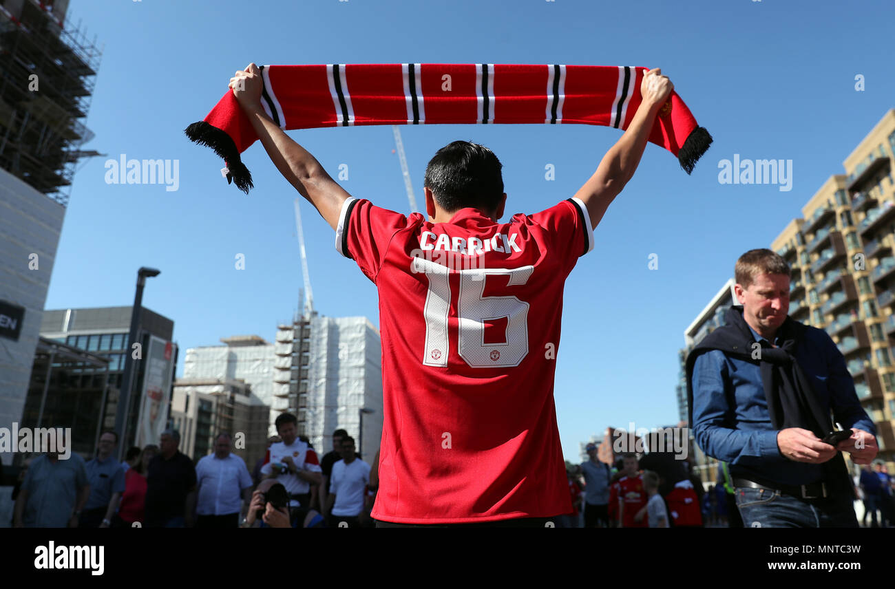 Manchester United fan holds up a scarf before the game during the ...