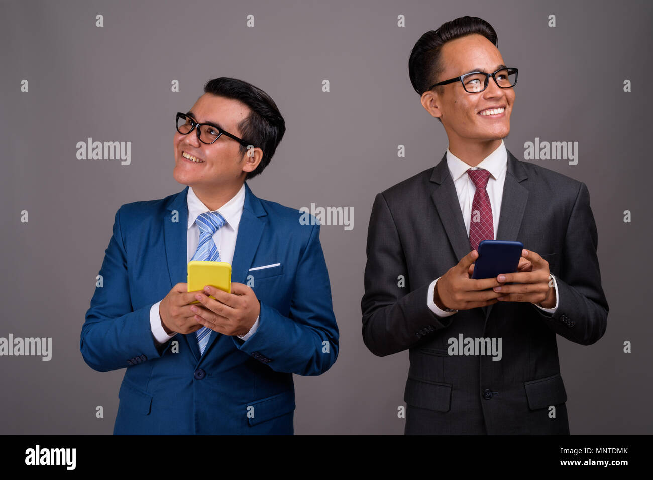 Young multi-ethnic businessman and young Indian businessman agai Stock ...