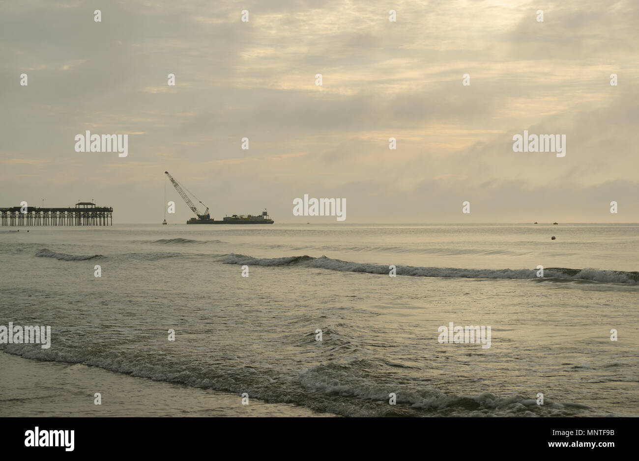 ship working at sea beach Stock Photo - Alamy