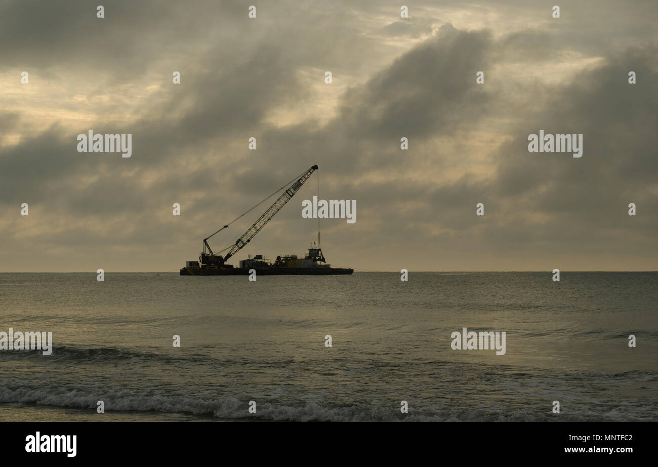 ship working at sea beach Stock Photo - Alamy