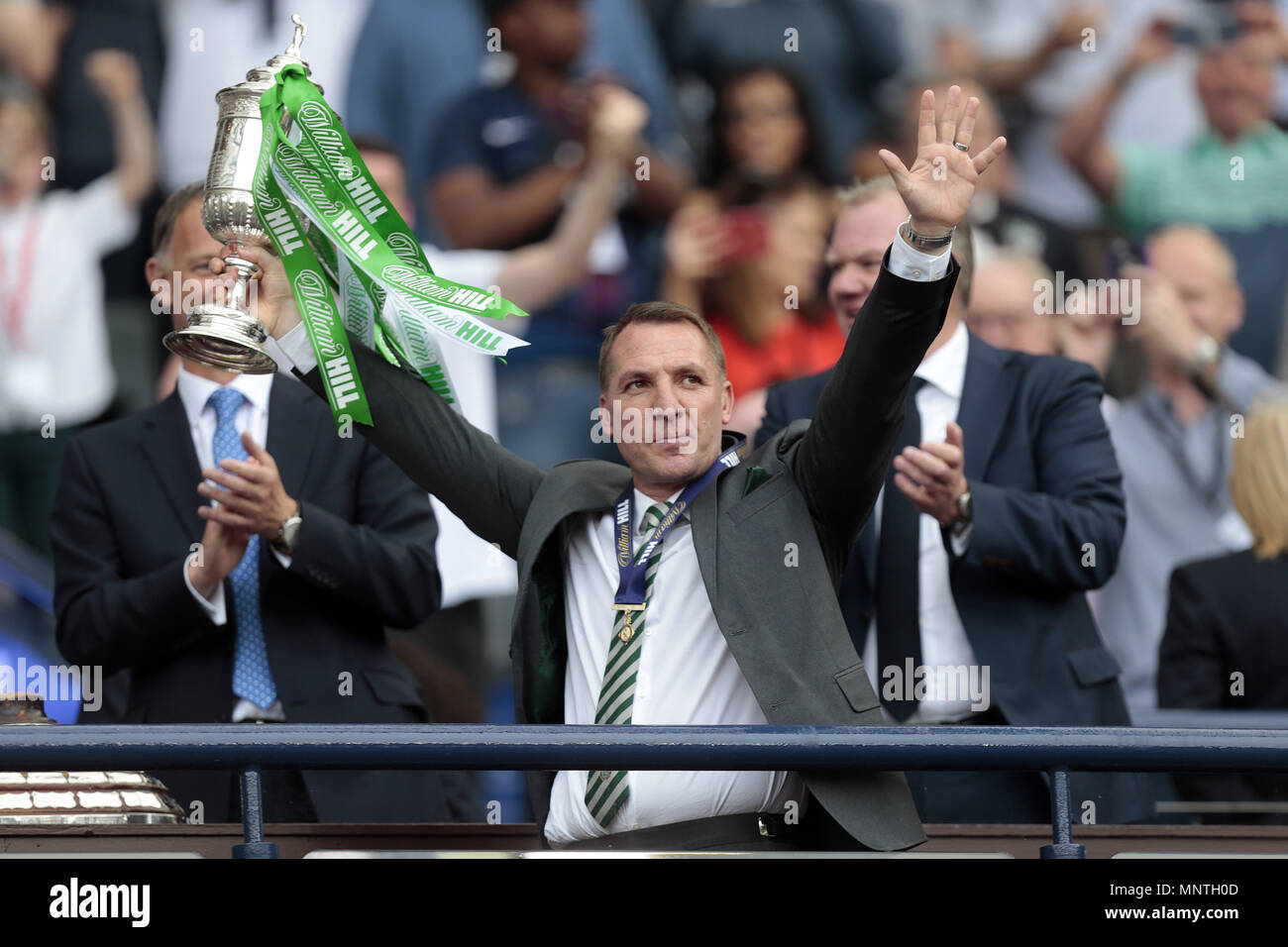 Celtic manager Brendan Rodgers lifts the trophy after winning the ...