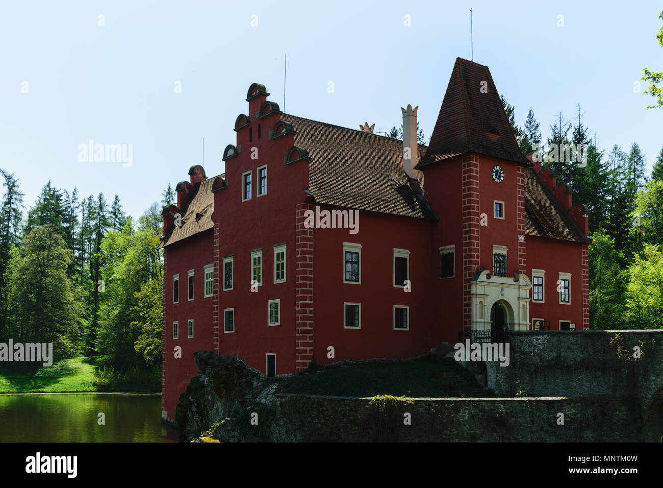 Red Castle on a Lake Stock Photo - Alamy