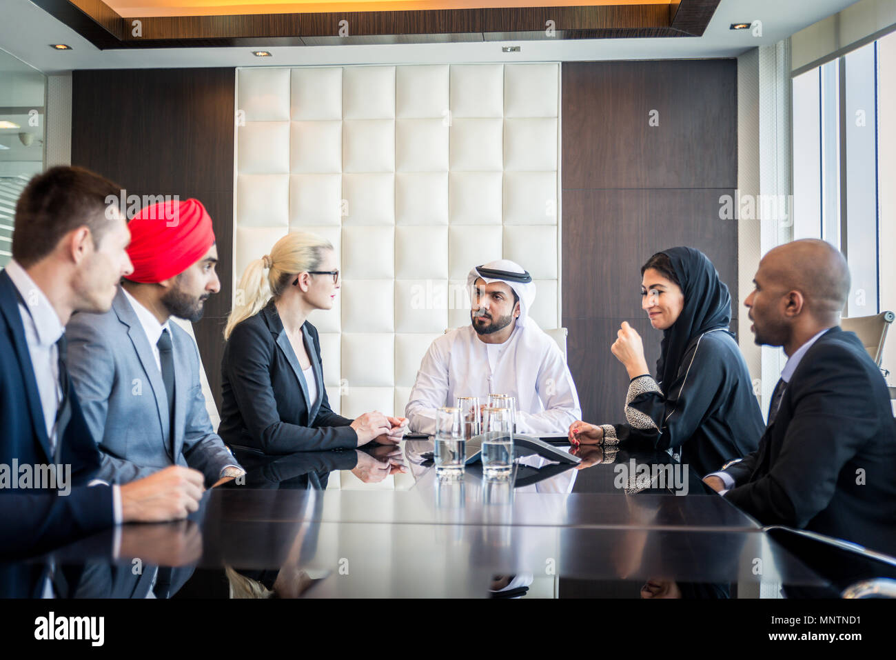 Multicultural business people meeting and talking about business ...