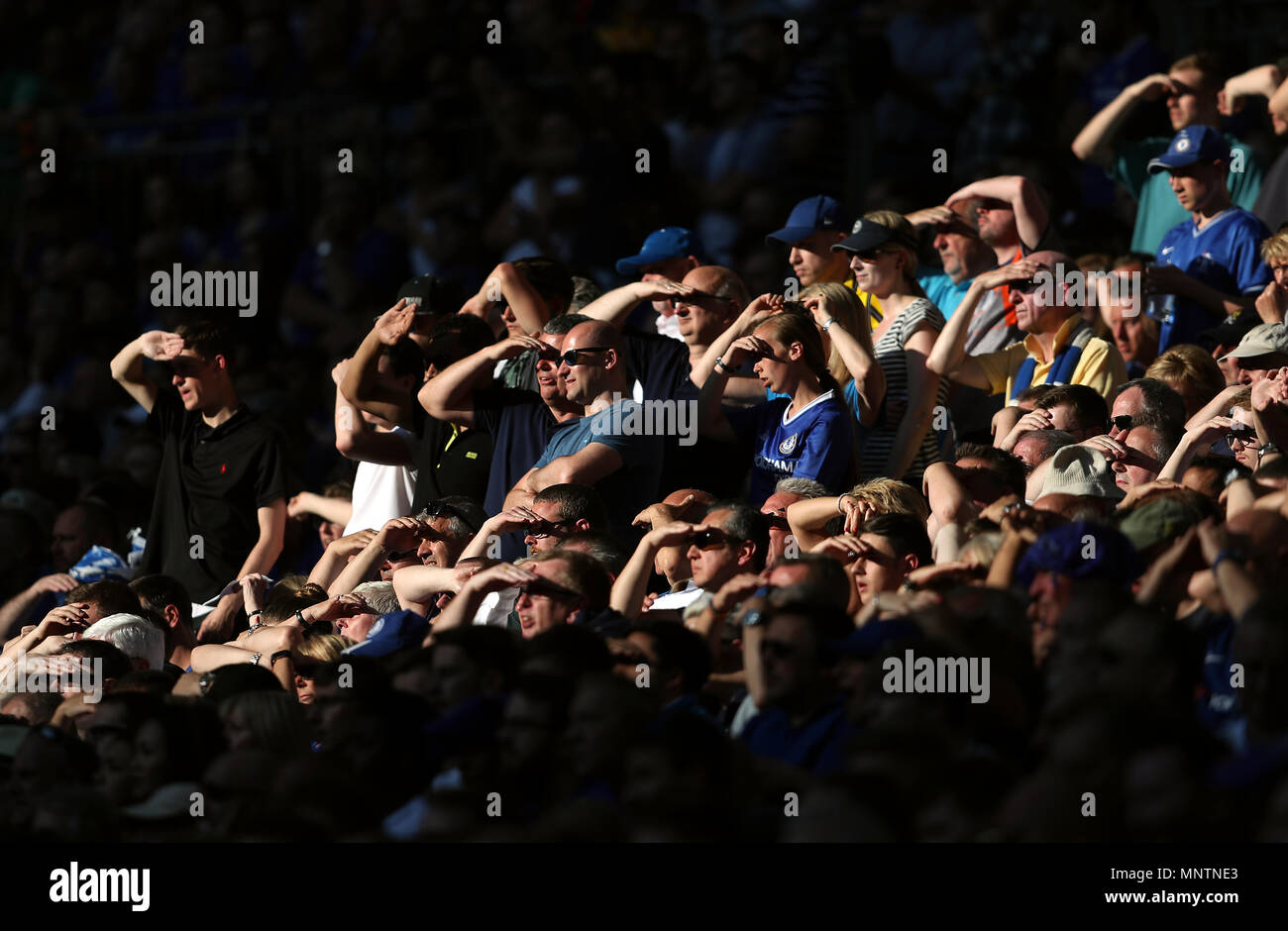 Chelsea fans shield their eyes from the sin during the Emirates FA Cup ...
