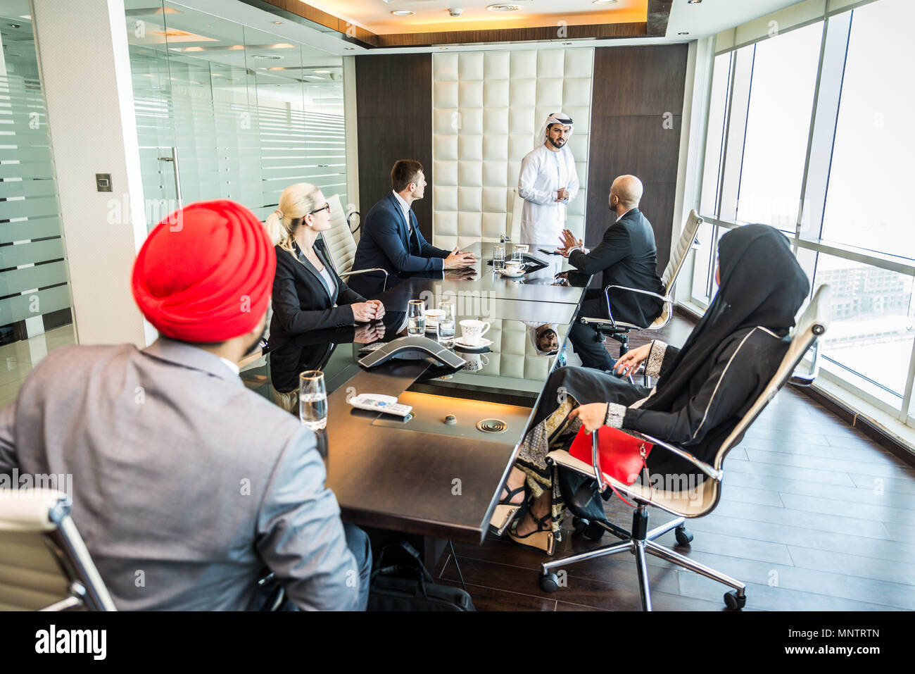 Multicultural business people meeting and talking about business ...