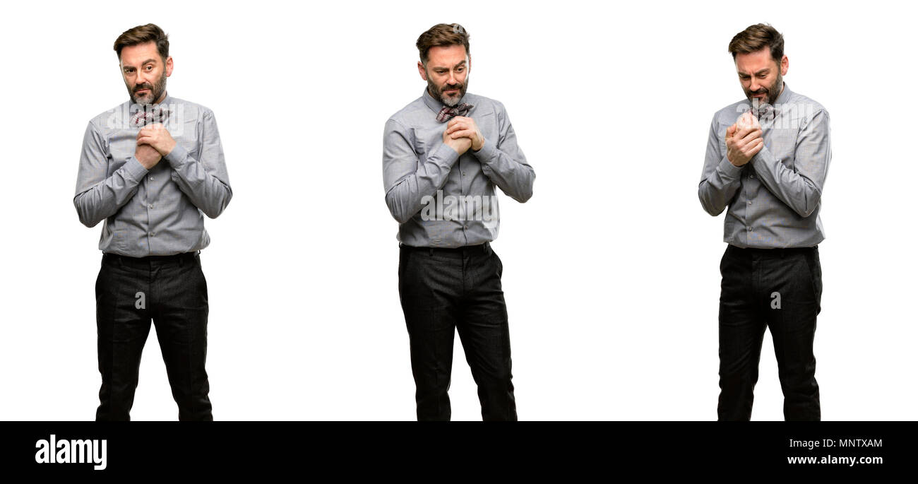 Middle age man, with beard and bow tie crying depressed full of sadness ...