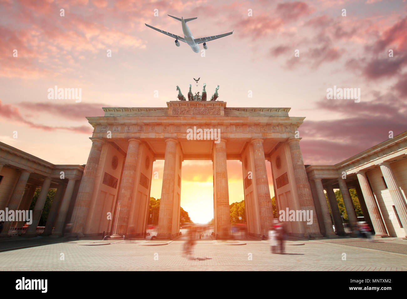 the plane is flying over Brandenburg Gate Stock Photo - Alamy