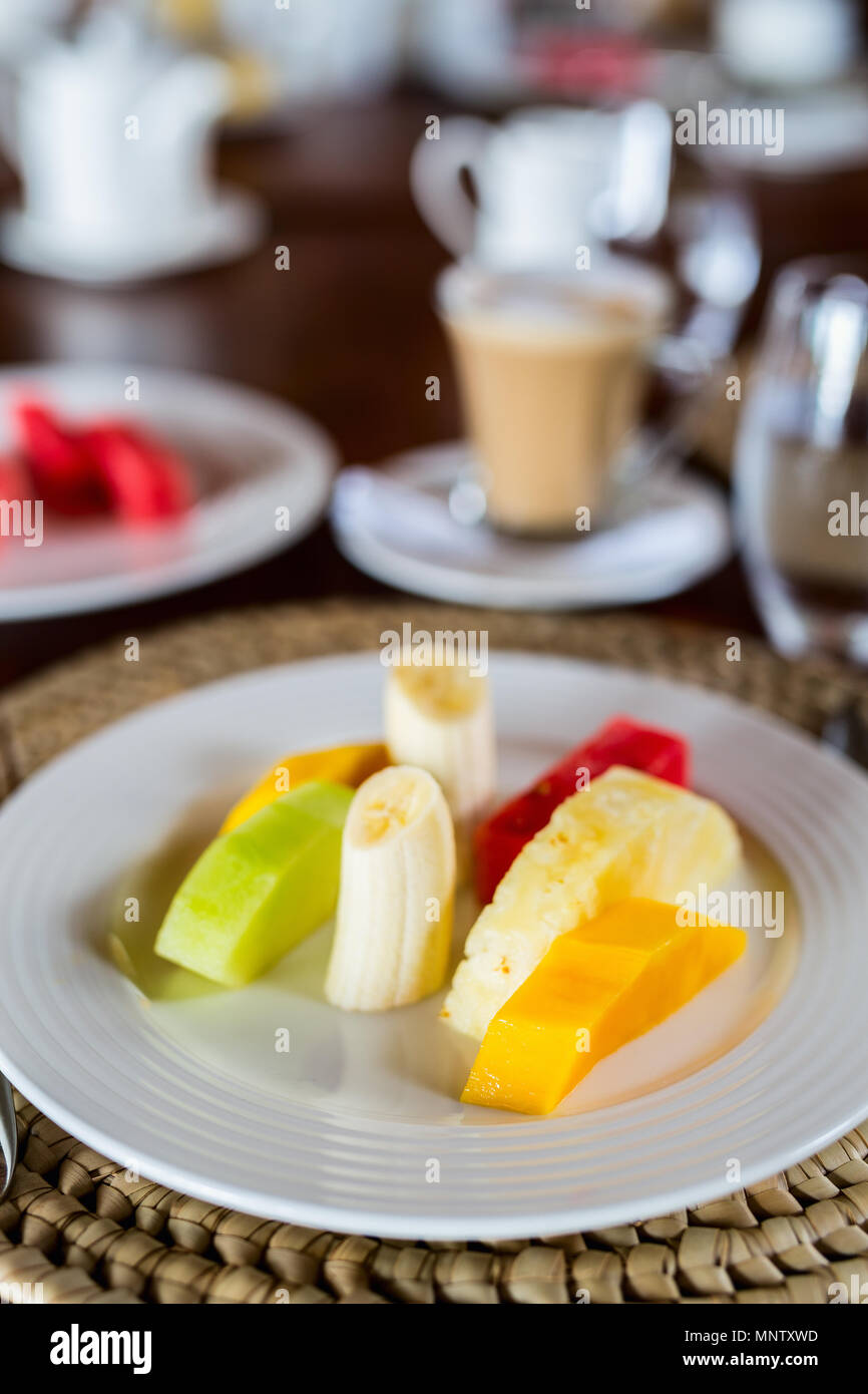 Delicious breakfast with tropical fruits Stock Photo - Alamy