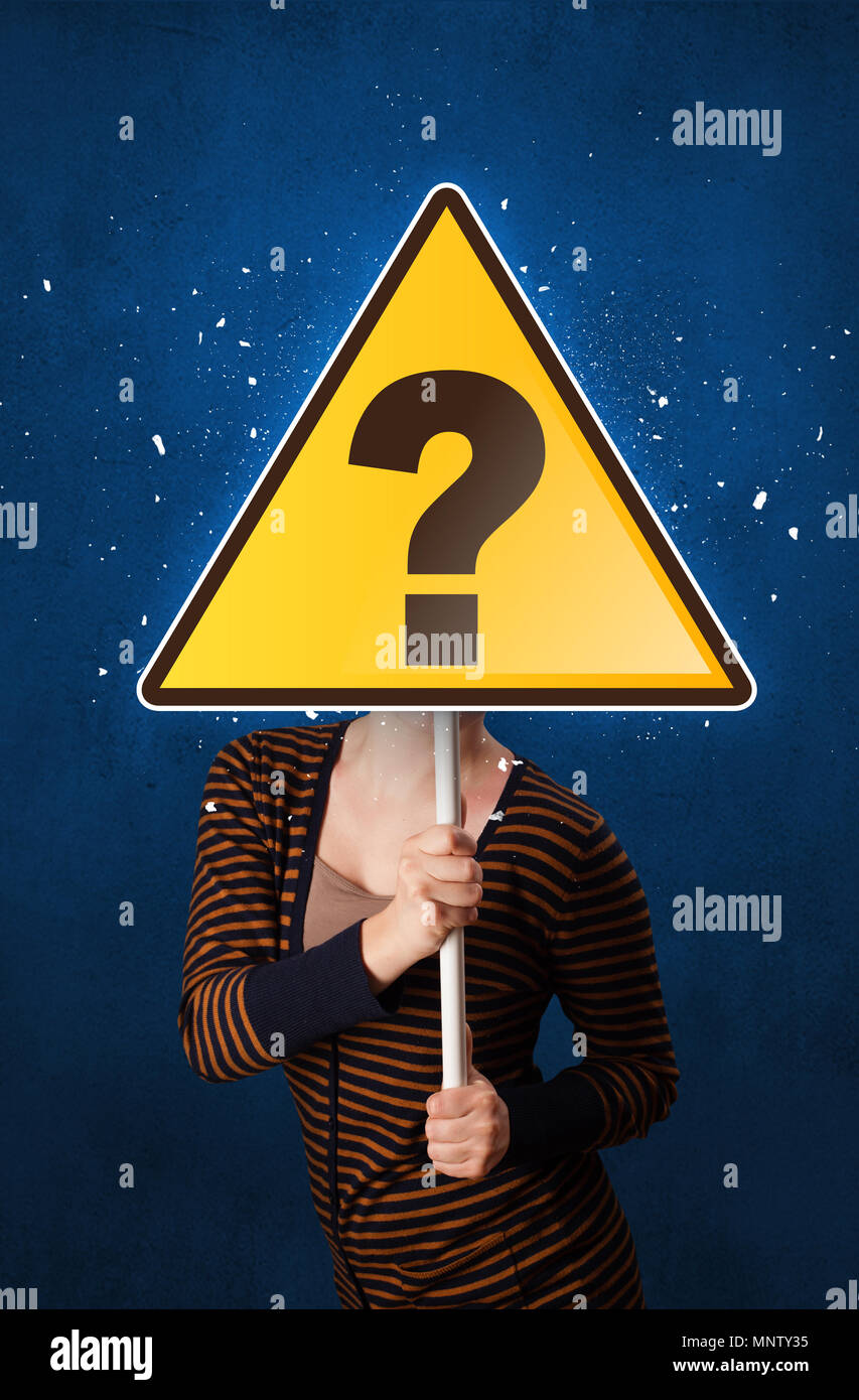 Casual young woman holding yellow sign with question mark Stock Photo ...