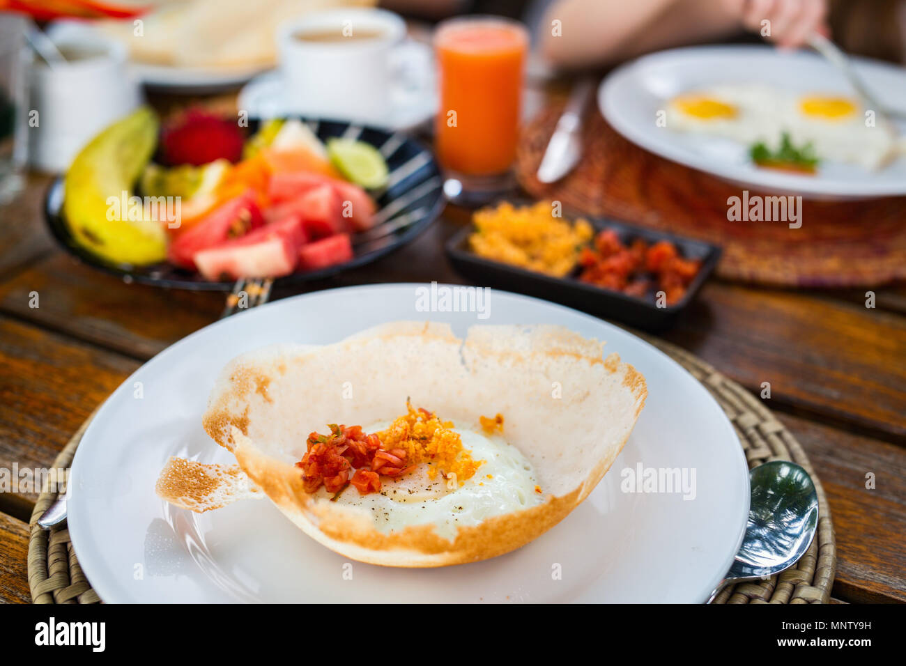 Traditional Sri Lankan breakfast with egg hoppers Stock Photo - Alamy