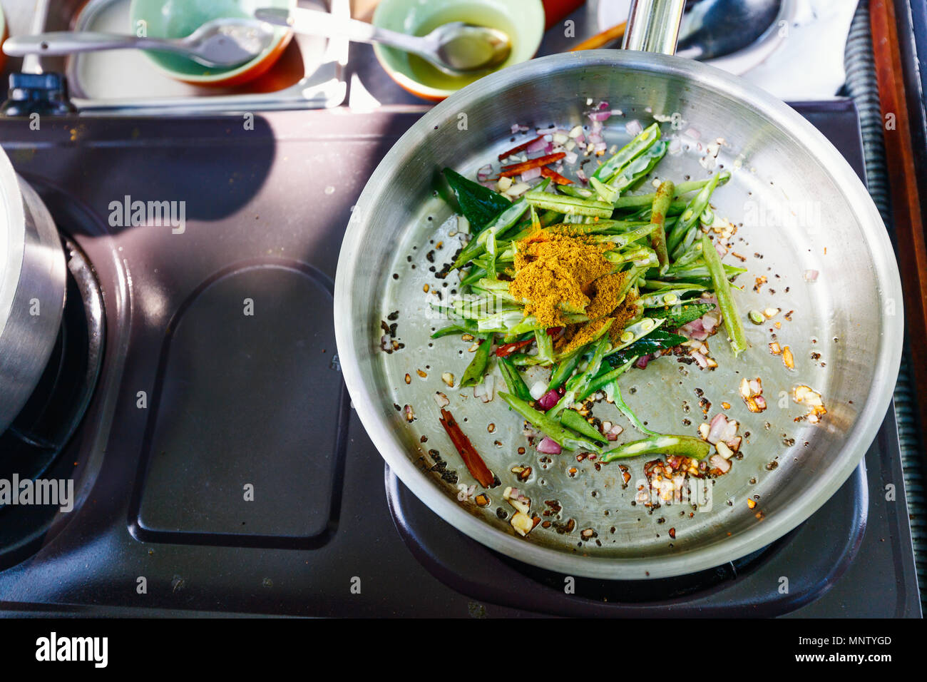 Preparation of traditional Sri Lankan curry dish at cooking class Stock ...