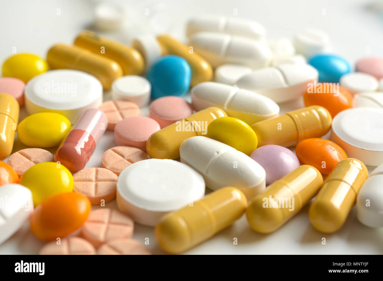 pile of generic drugs on white table - closeup Stock Photo - Alamy