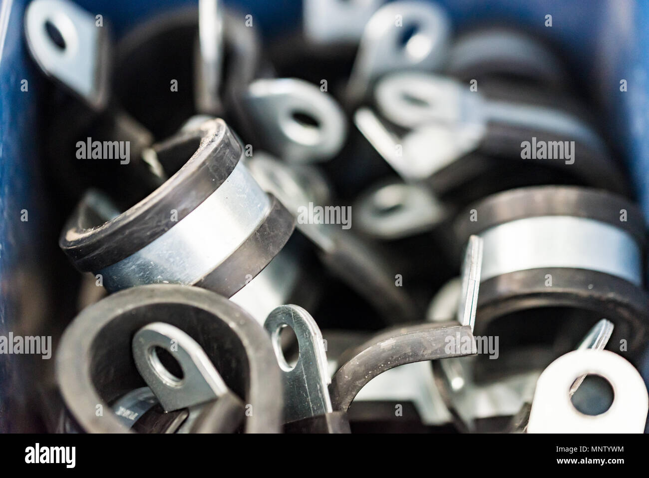 P-shaped clamps background Stock Photo - Alamy