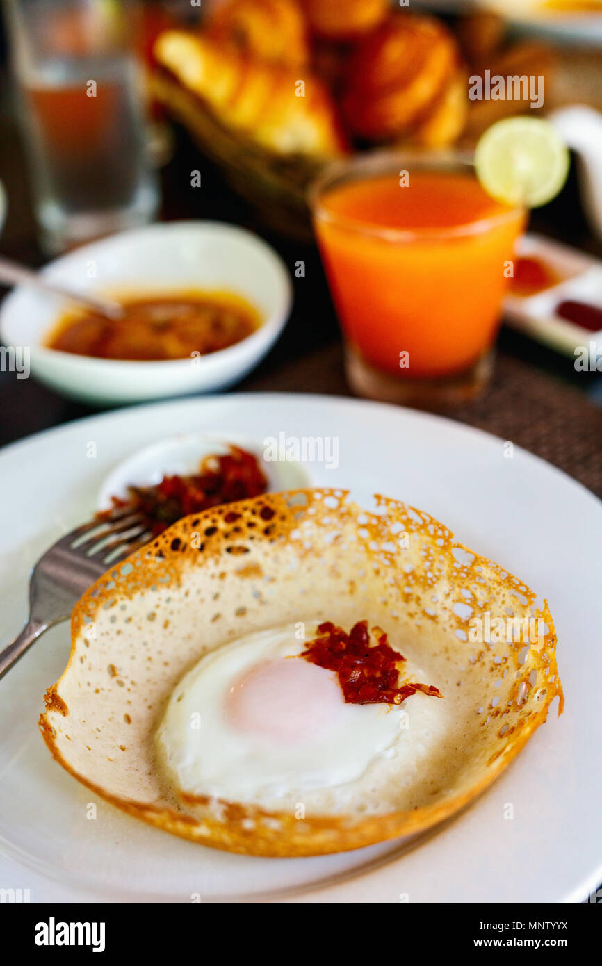 Traditional Sri Lankan breakfast with egg hoppers Stock Photo - Alamy