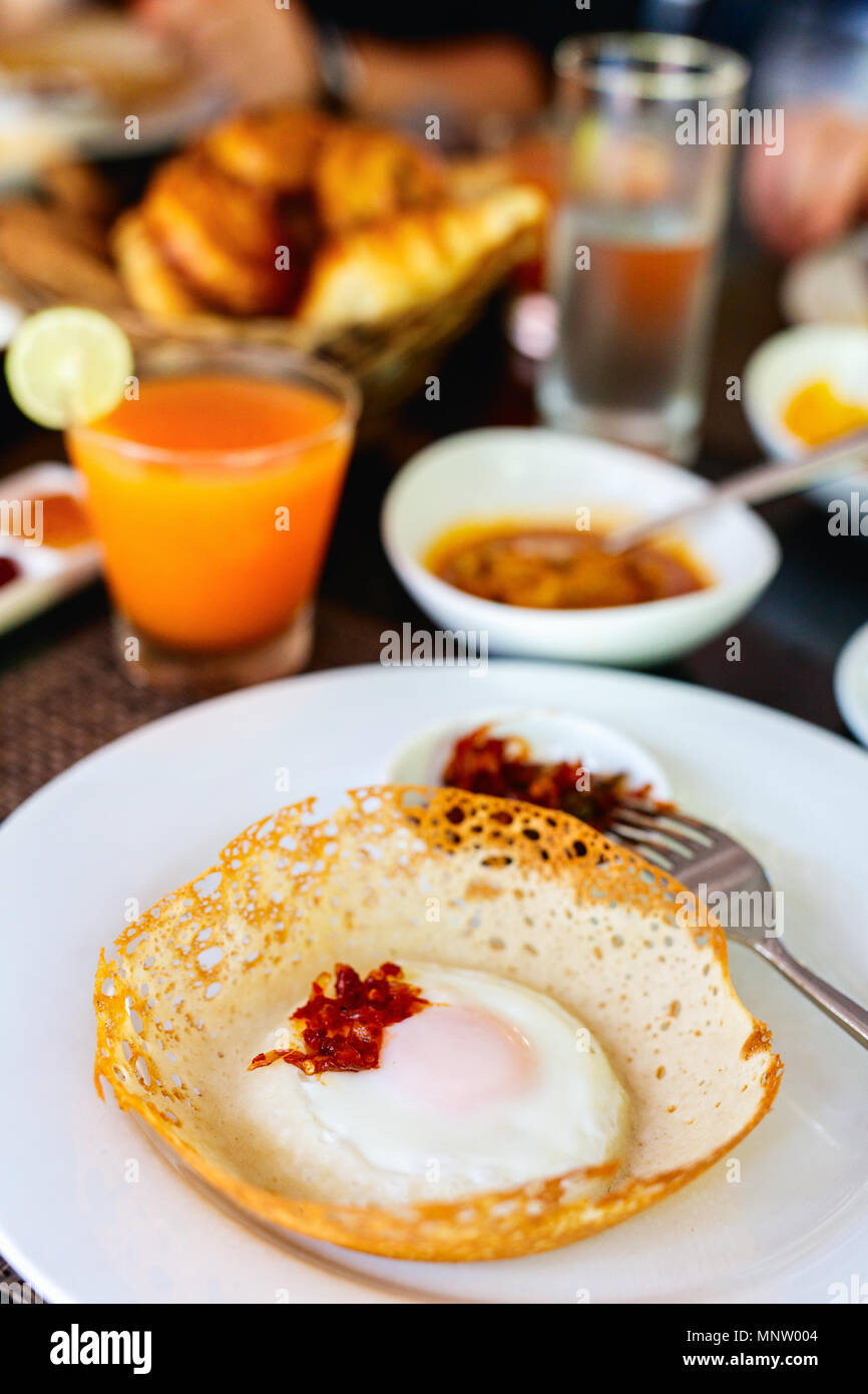Traditional Sri Lankan breakfast with egg hoppers Stock Photo - Alamy