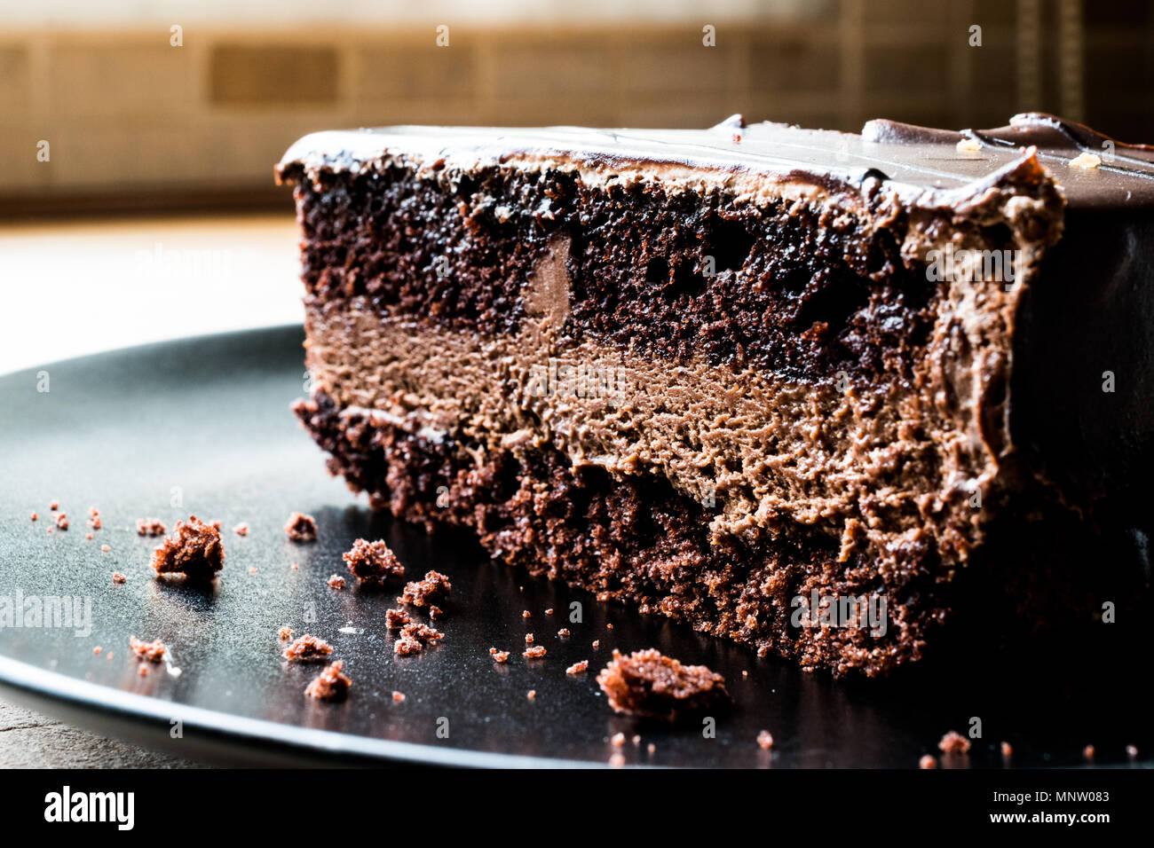 Devils Cake with Chocolate in black plate. Dessert Concept Stock Photo ...