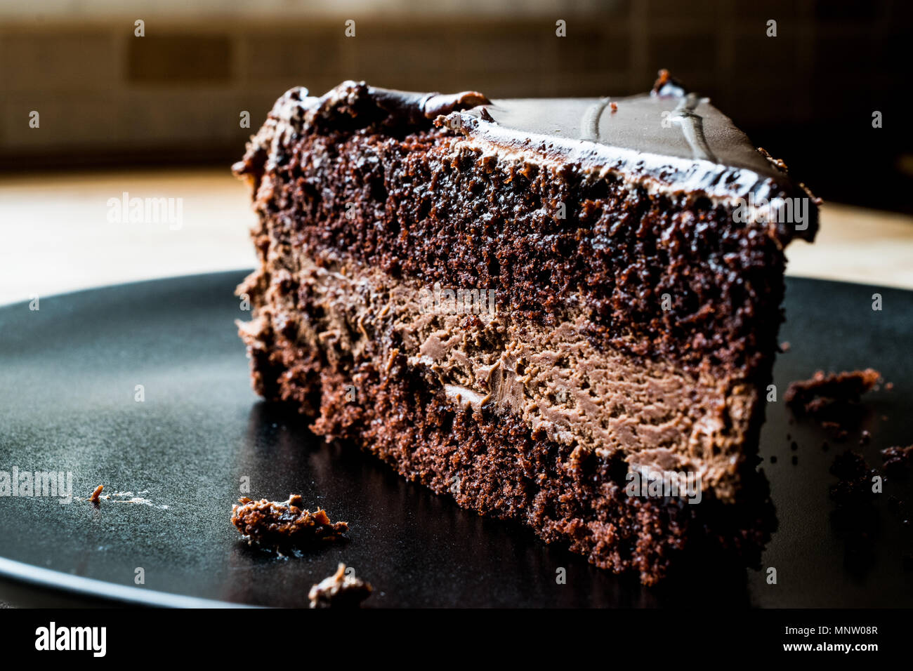 Devils Cake with Chocolate in black plate. Dessert Concept Stock Photo ...