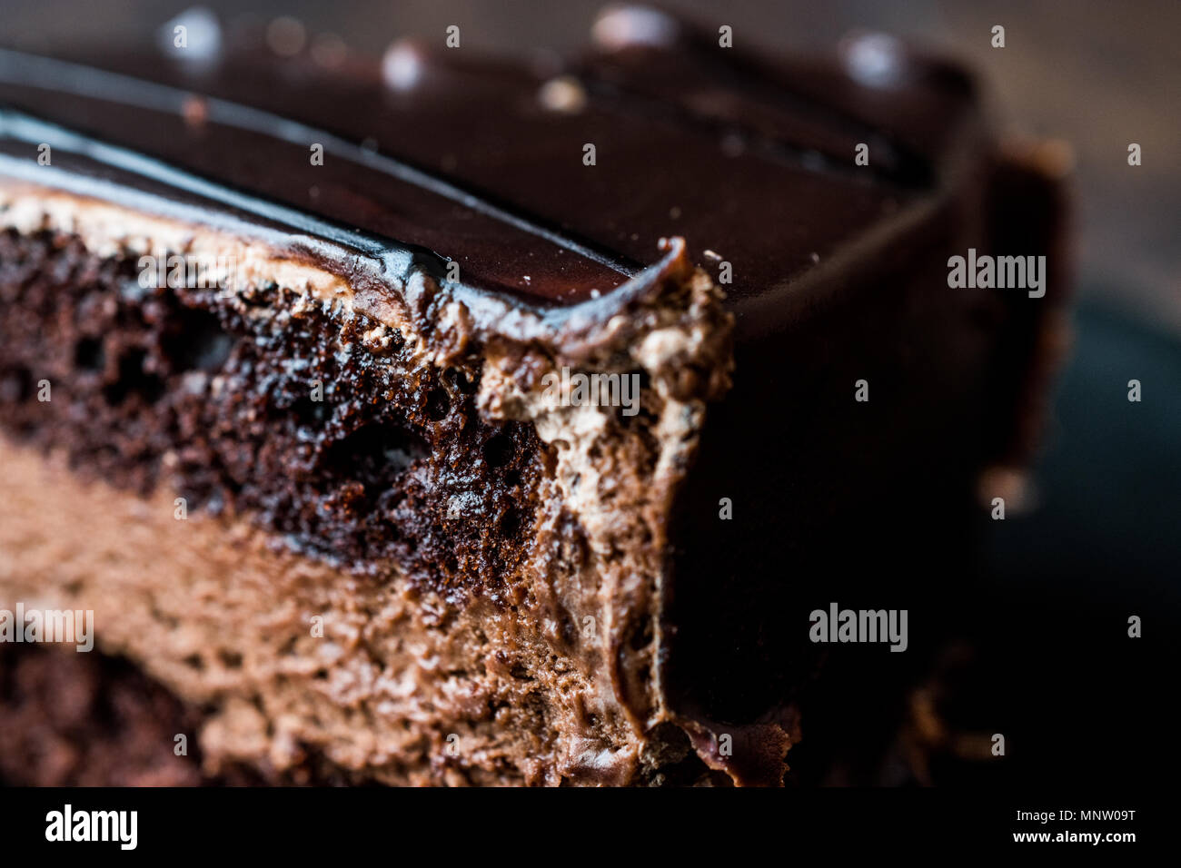 Devils Cake with Chocolate in black plate. Dessert Concept Stock Photo ...