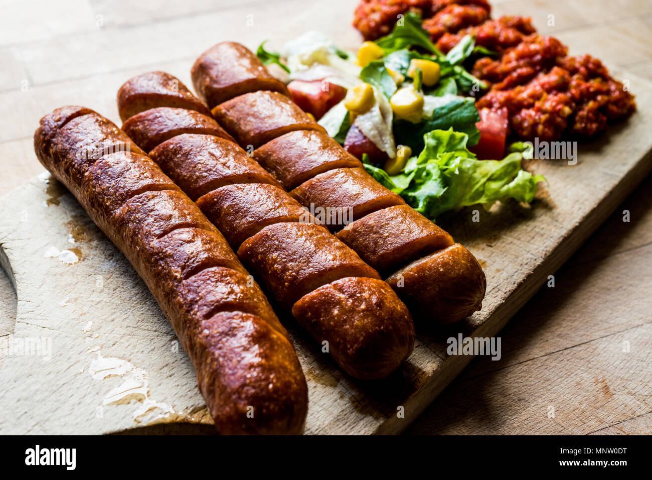 Frankfurter Grilled Sausages with salad and salsa sauce. fast food ...