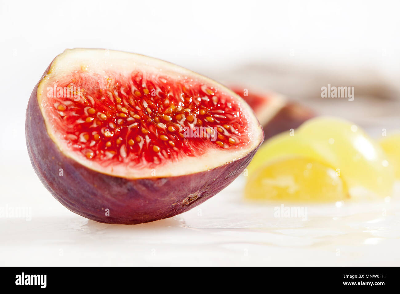 half fig on white background Stock Photo - Alamy