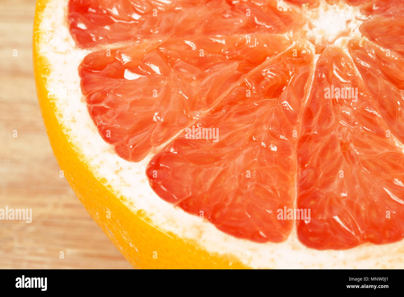 blood orange from above, half open on wooden background Stock Photo - Alamy